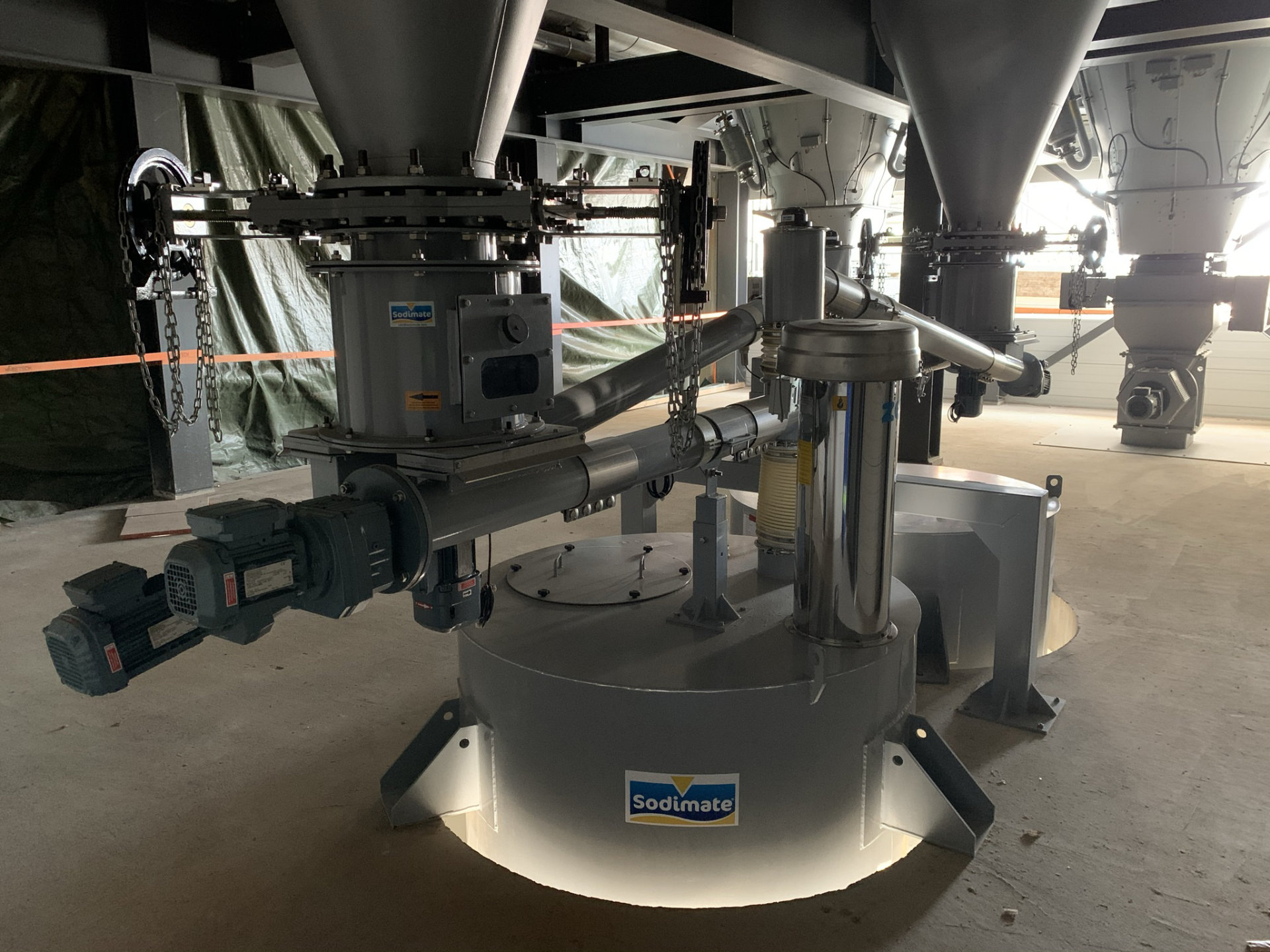 Dosiergerät für Sackeinschüttung, Puffer- oder Wägebehälter